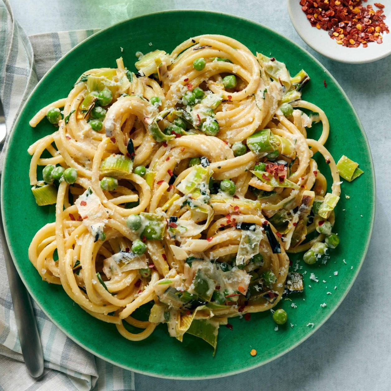 Creamy Bucatini with Charred Leeks and Peas | Savory